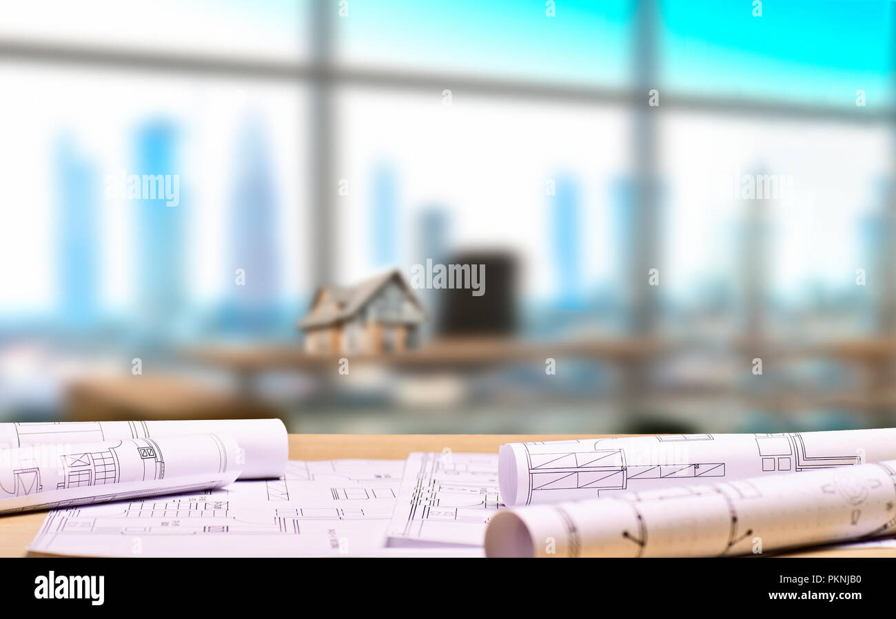 Architectural office with blueprints and an architectural model on a ...