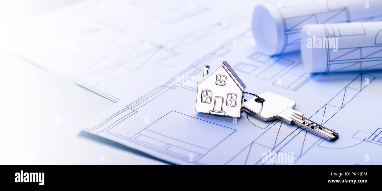 Key with house as a key fob on blueprints in panorama format Stock ...