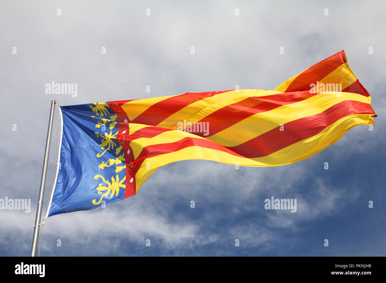 Flag of Comunidad Valenciana, region in Spain. Moving in the wind Stock ...