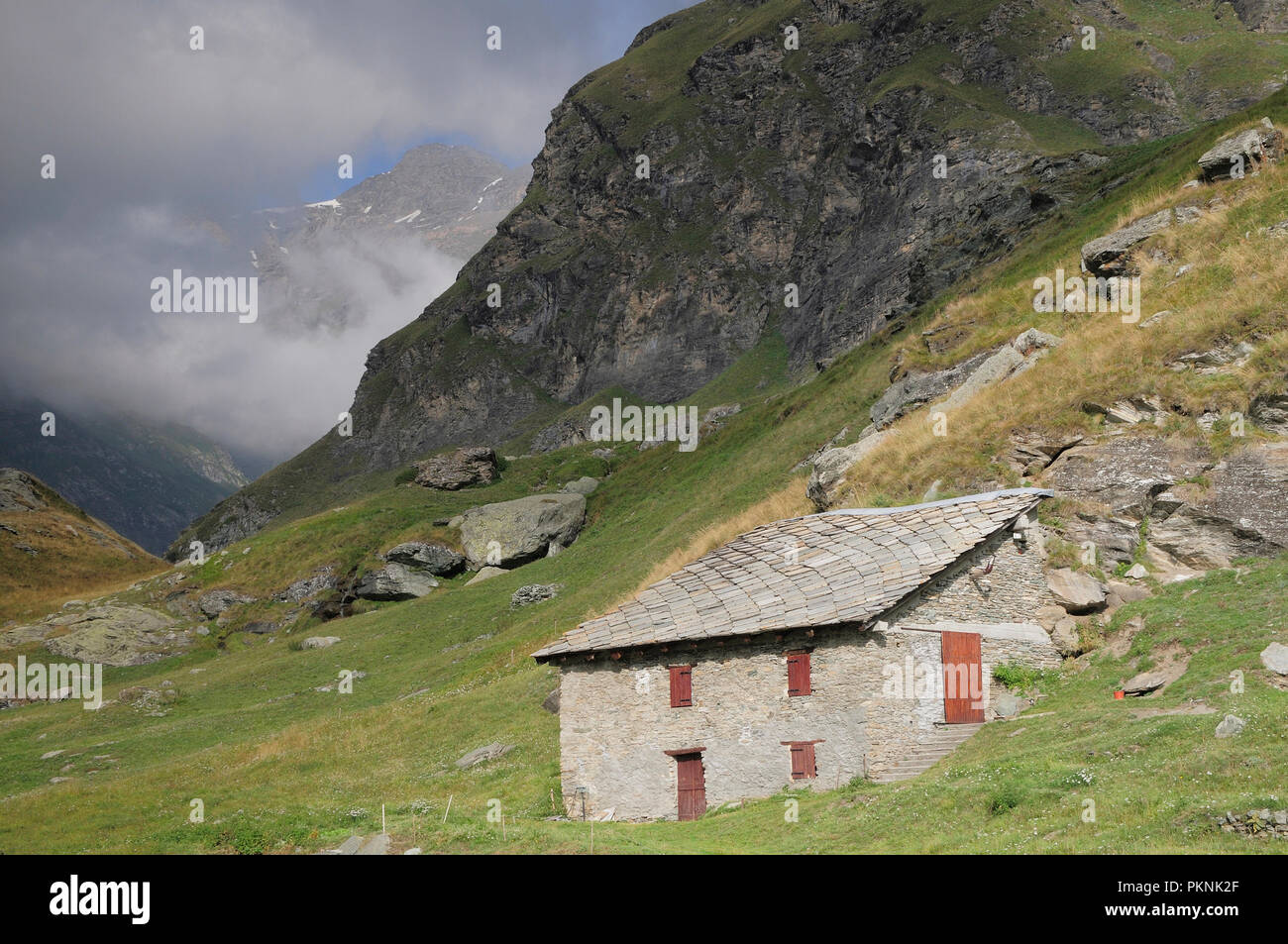 Italy, Piedmont, Val di Viu, farm buildings at Lago di Malciaussia ...
