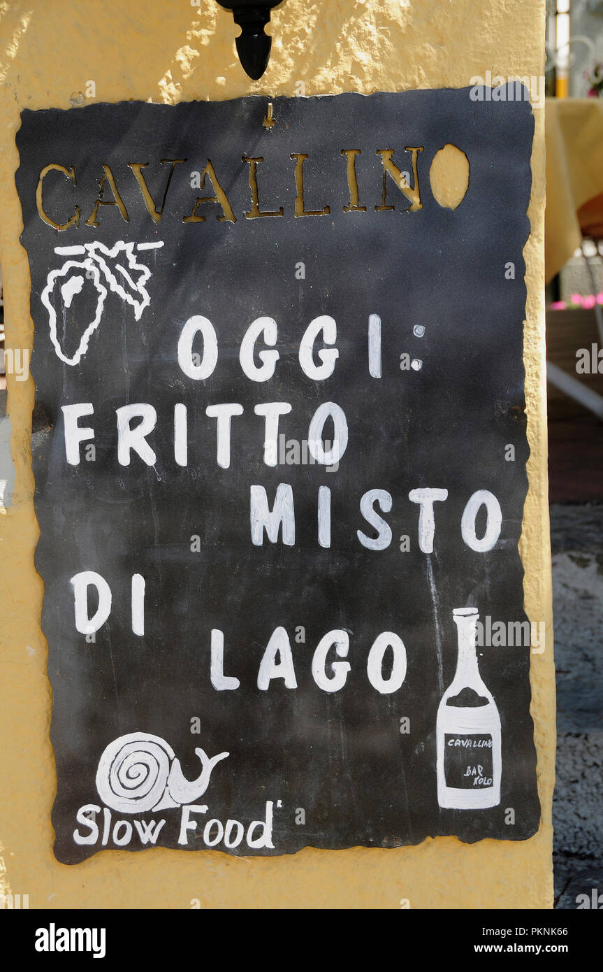 Italy, Lombardy, Lake Como, Slow Food restaurant sign Stock Photo - Alamy