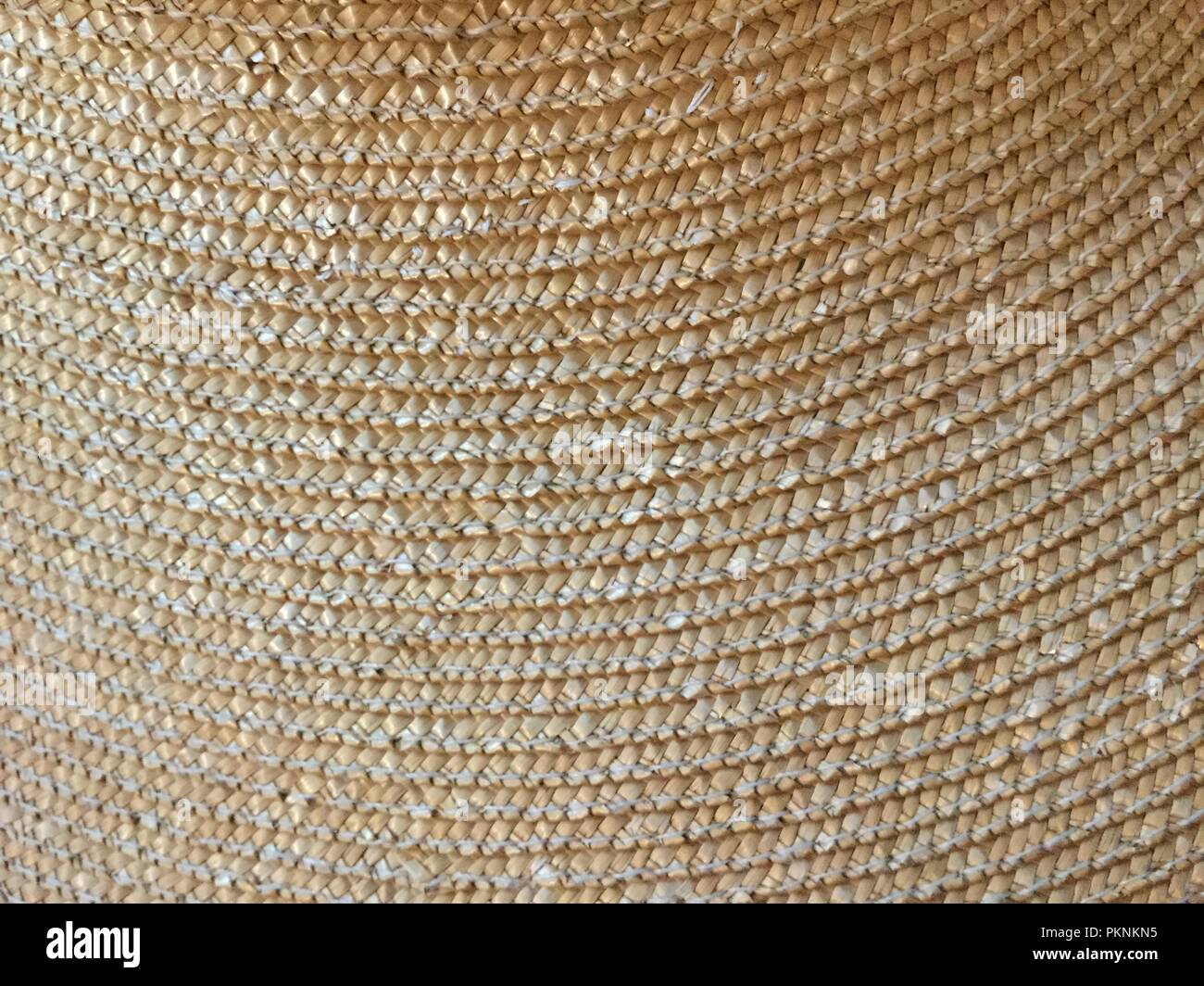 Woven tan pattern creating a half circular design Stock Photo - Alamy
