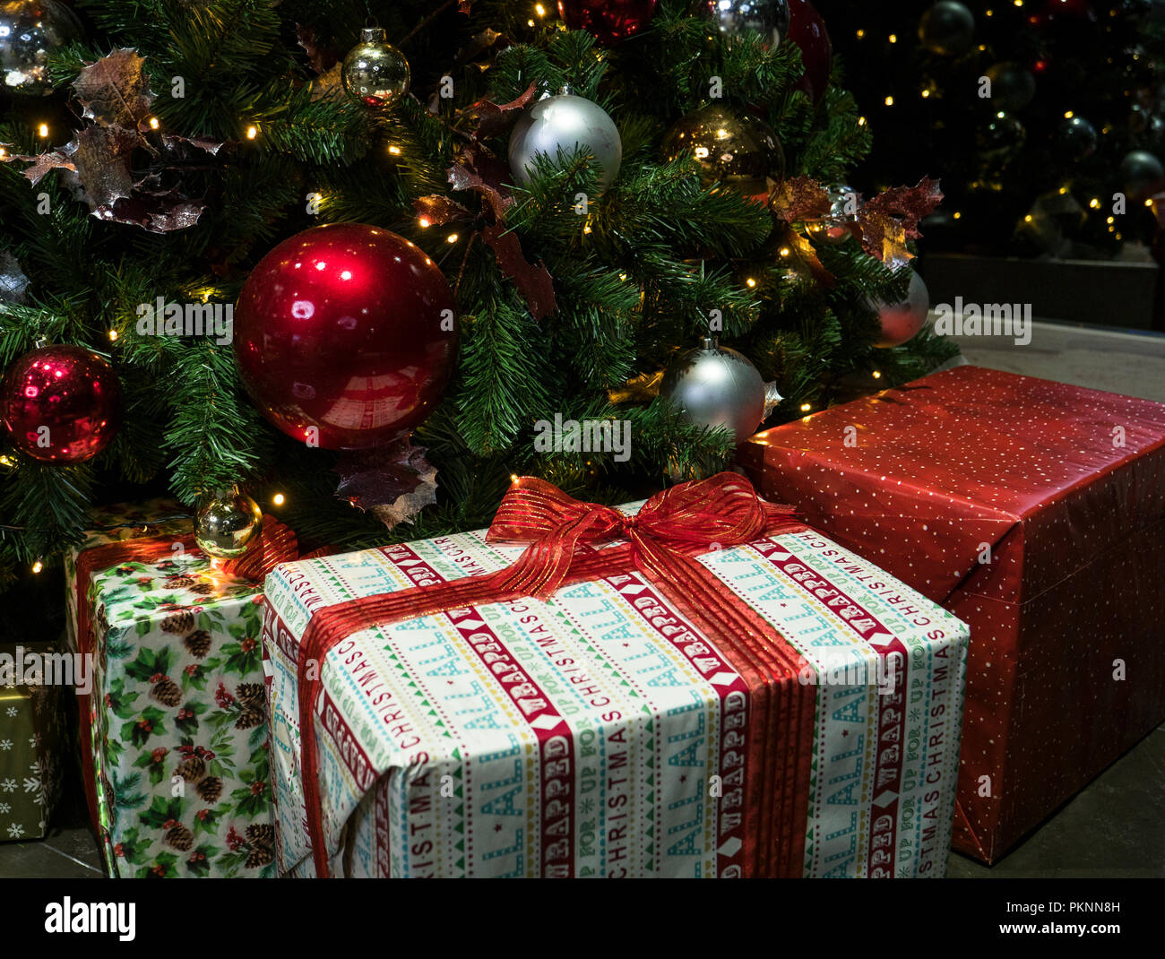 Wrapping paper next to christmas tree hi-res stock photography and ...