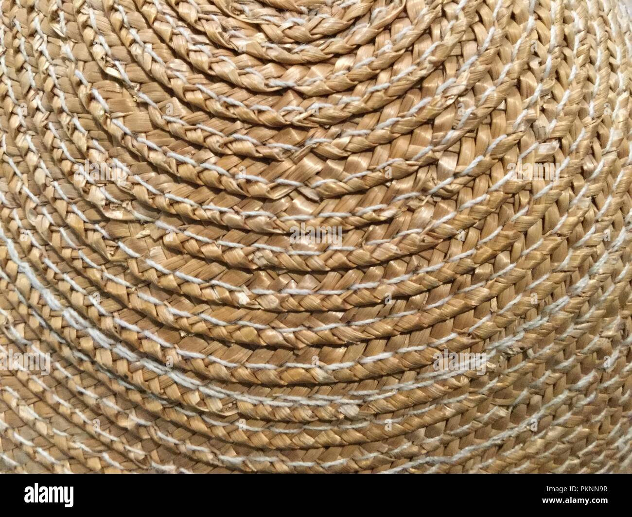 Woven tan pattern creating a half circular design Stock Photo - Alamy