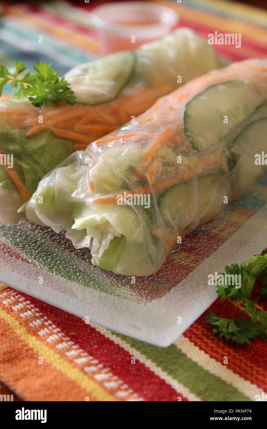Fresh Vietnamese rolls wrapped in rice paper filled with vegetables and ...