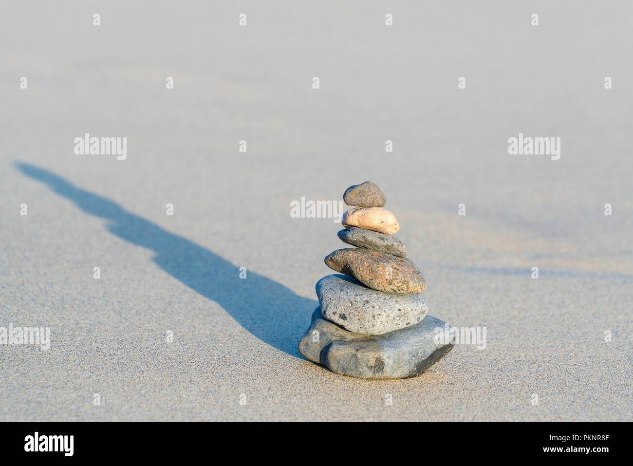 Stacked stones on a beach Stock Photo - Alamy