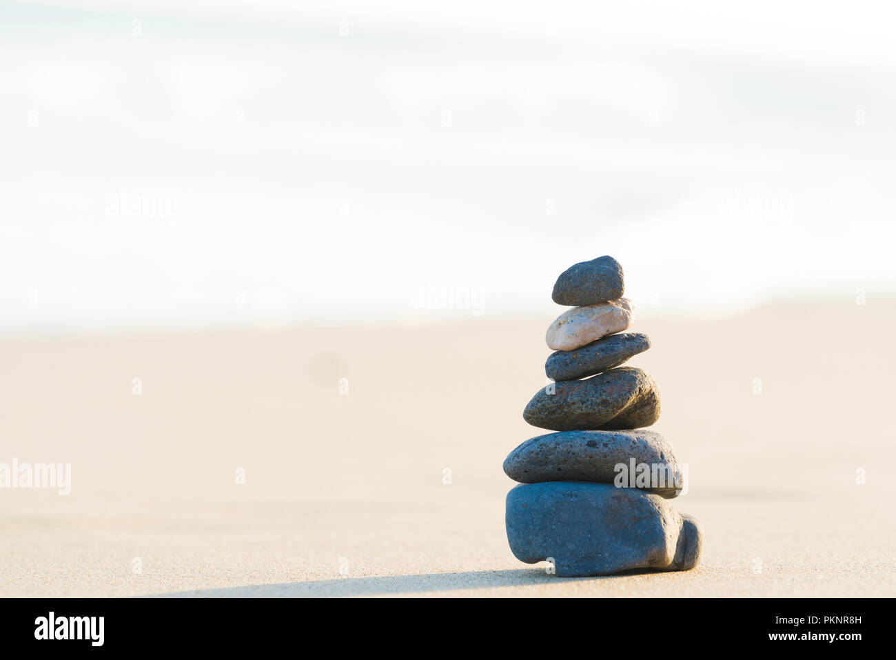 Stacked stones on a beach Stock Photo - Alamy