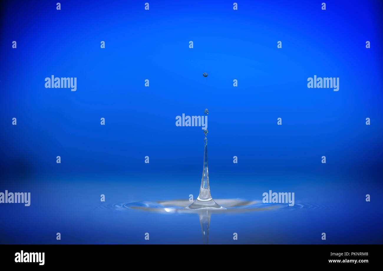 Water drop impact Stock Photo - Alamy