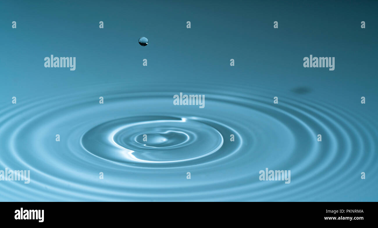 Water drop impact Stock Photo - Alamy