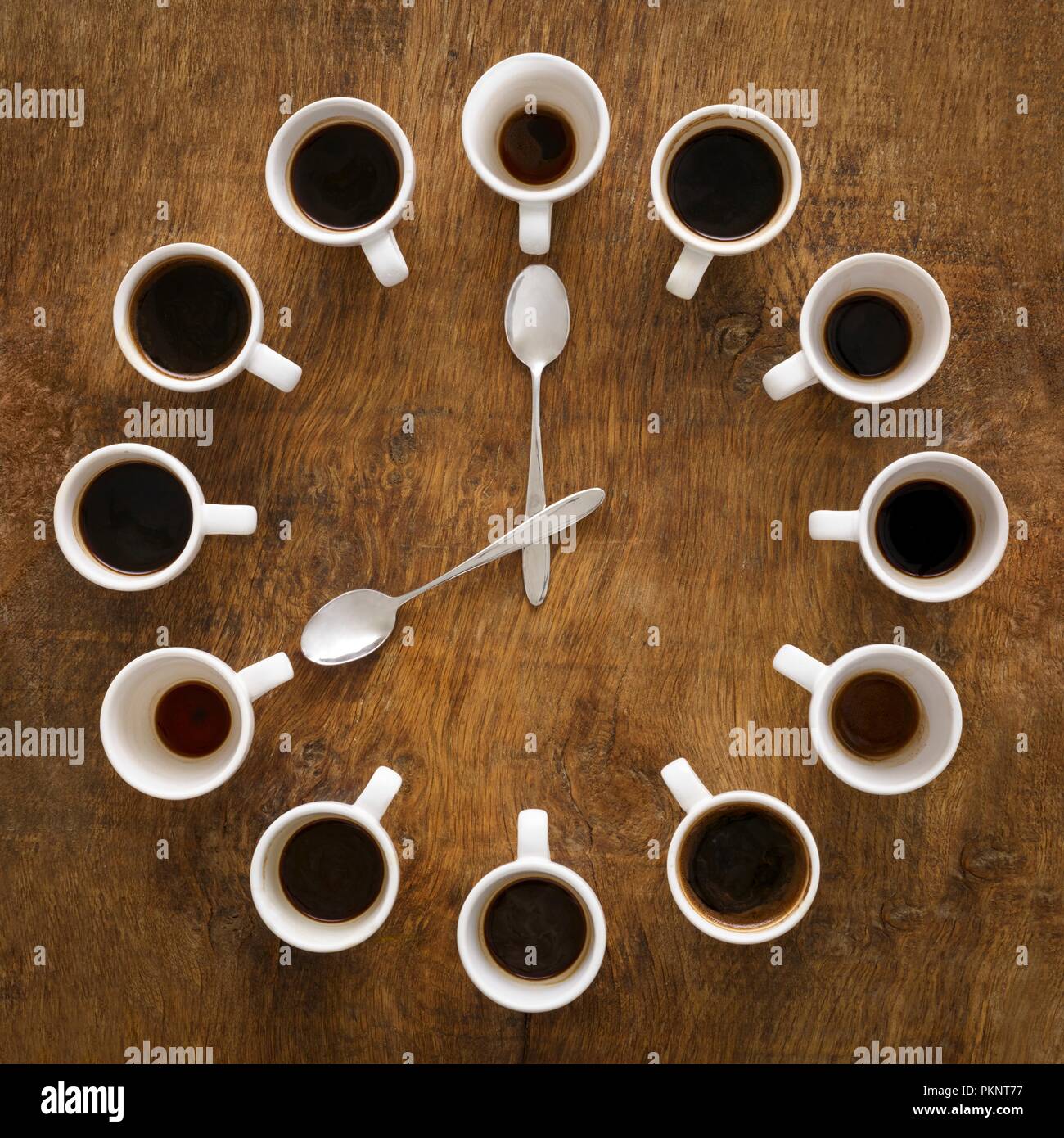 Cups of coffee making the shape of a clock Stock Photo - Alamy