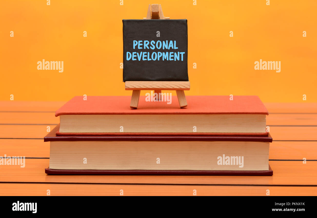 Personal development theme with empty books on wooden background Stock ...