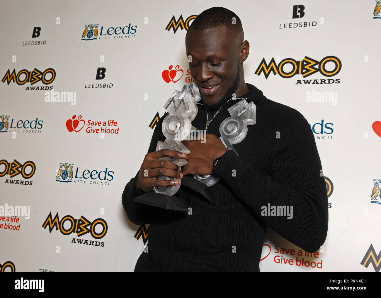Stormzy at the 2017 MOBO Awards on 29 November 2017. Stormzy is holding ...