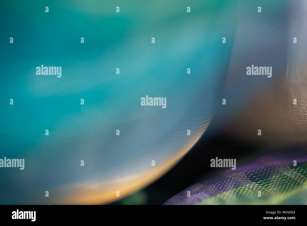 Blurry extreme close up macro of chiffon fabric. Beautiful sensual shapes colorful background ...