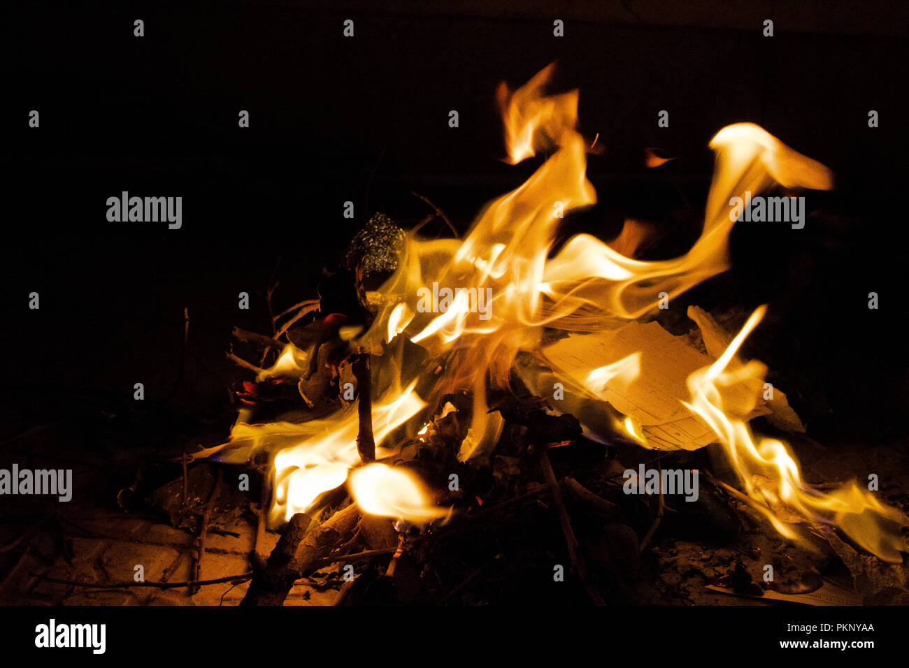 this is yellow orange fire burning paper Stock Photo - Alamy
