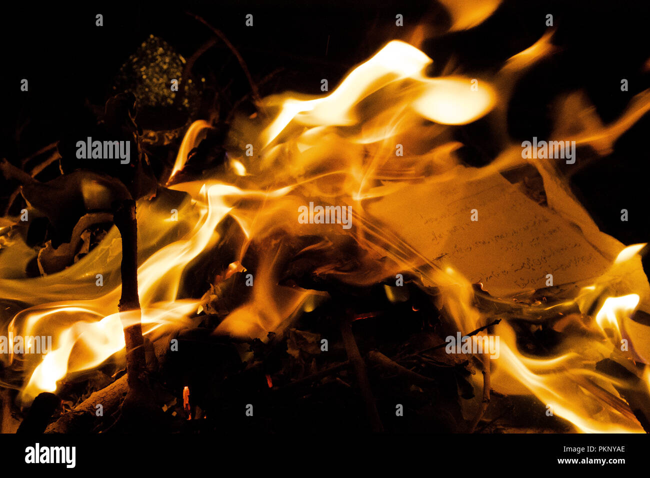 this is yellow orange fire burning paper Stock Photo - Alamy