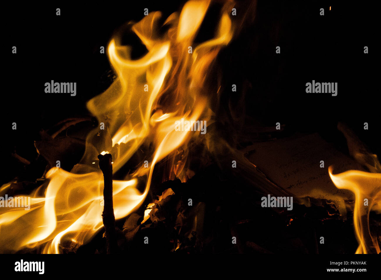 this is yellow orange fire burning paper Stock Photo - Alamy