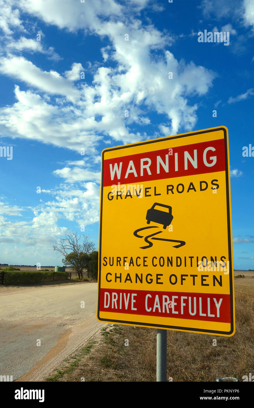 Warning: gravel road sign, outback Australia Stock Photo - Alamy
