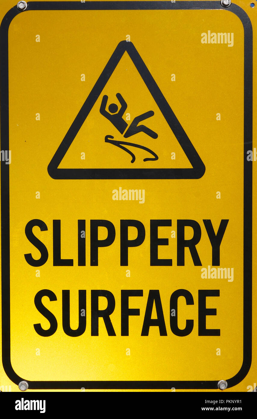 Slippery Surface sign Stock Photo - Alamy