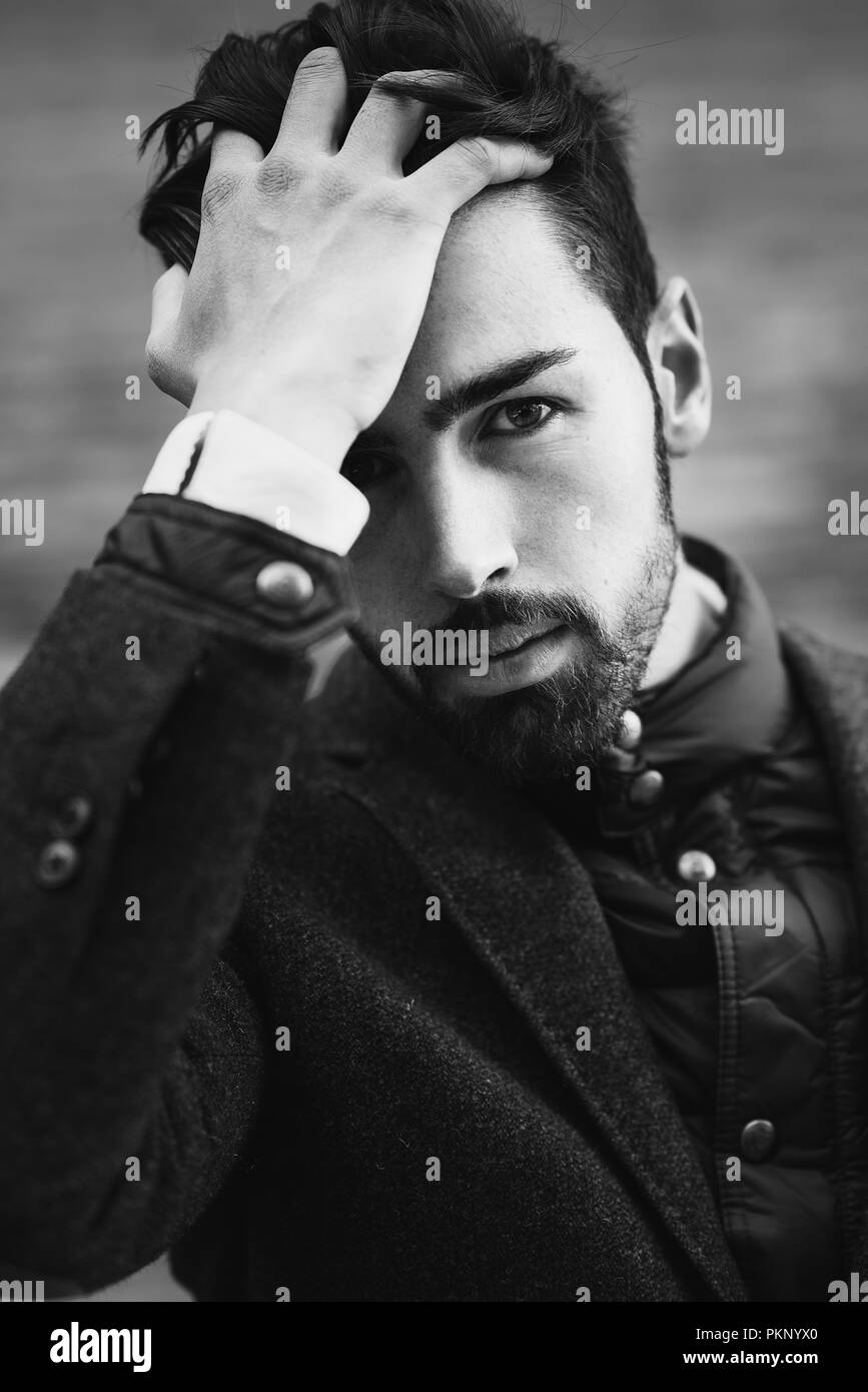 Young bearded man, model of fashion, in urban background wearing ...