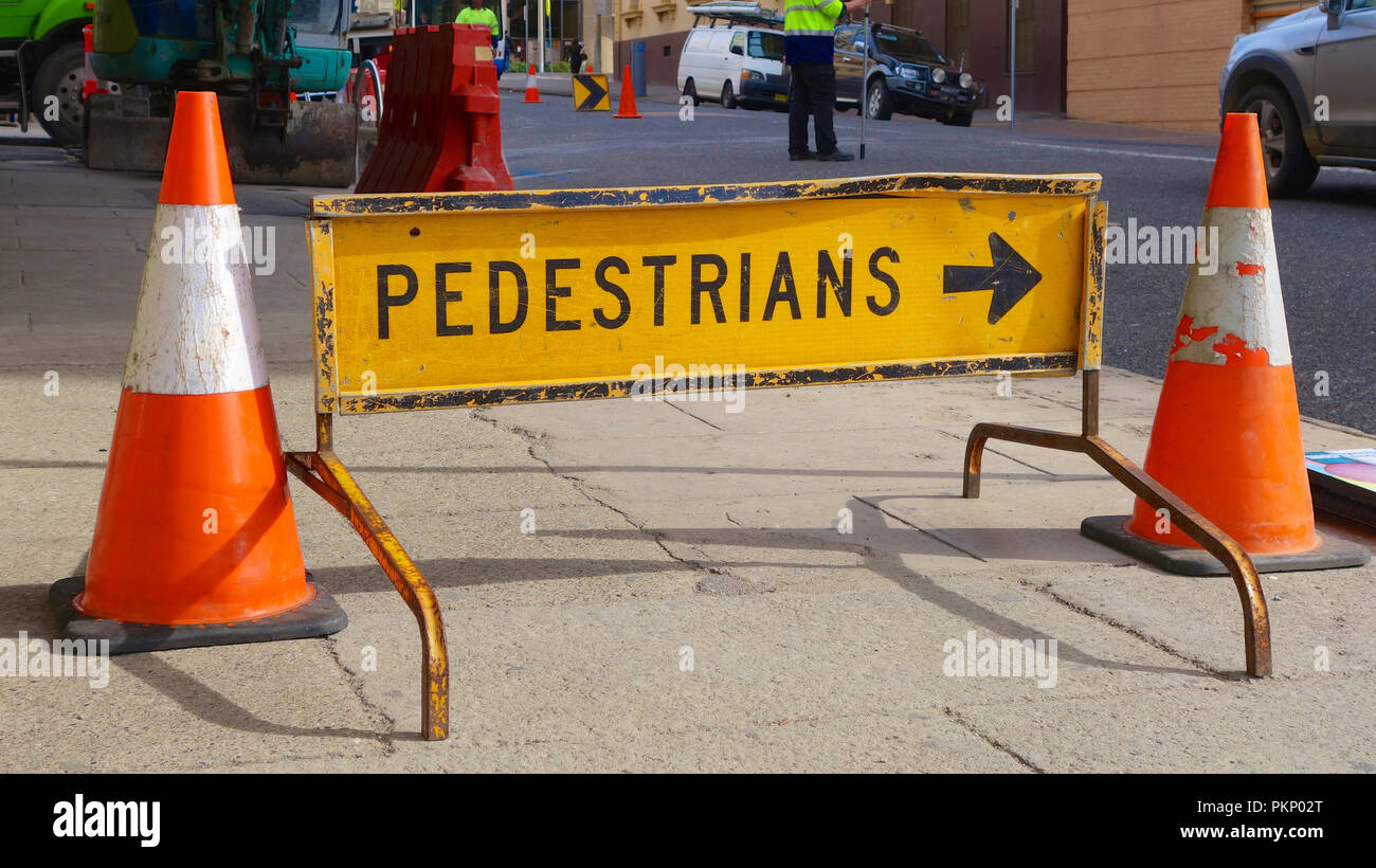 Pedestrian safety sign on a city street, Australia Stock Photo - Alamy