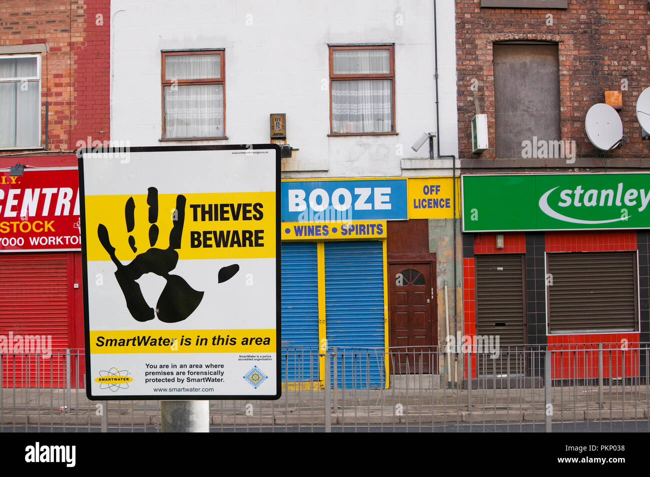 Boarded up shops in a rough area of Liverpool UK Stock Photo - Alamy