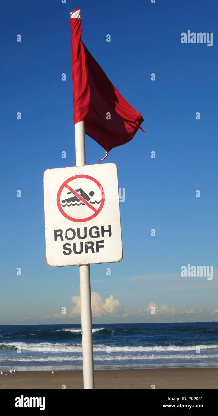 Rough Surf sign with a red flag on an Australian beach Stock Photo - Alamy