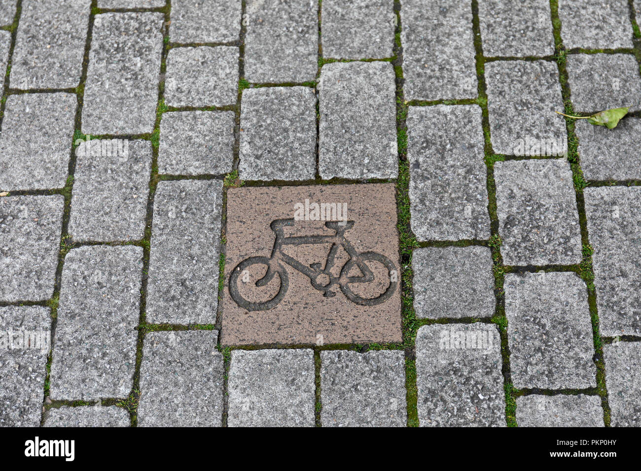 Brown square Bicycle tile showing cycling route, Bristol, England Stock ...
