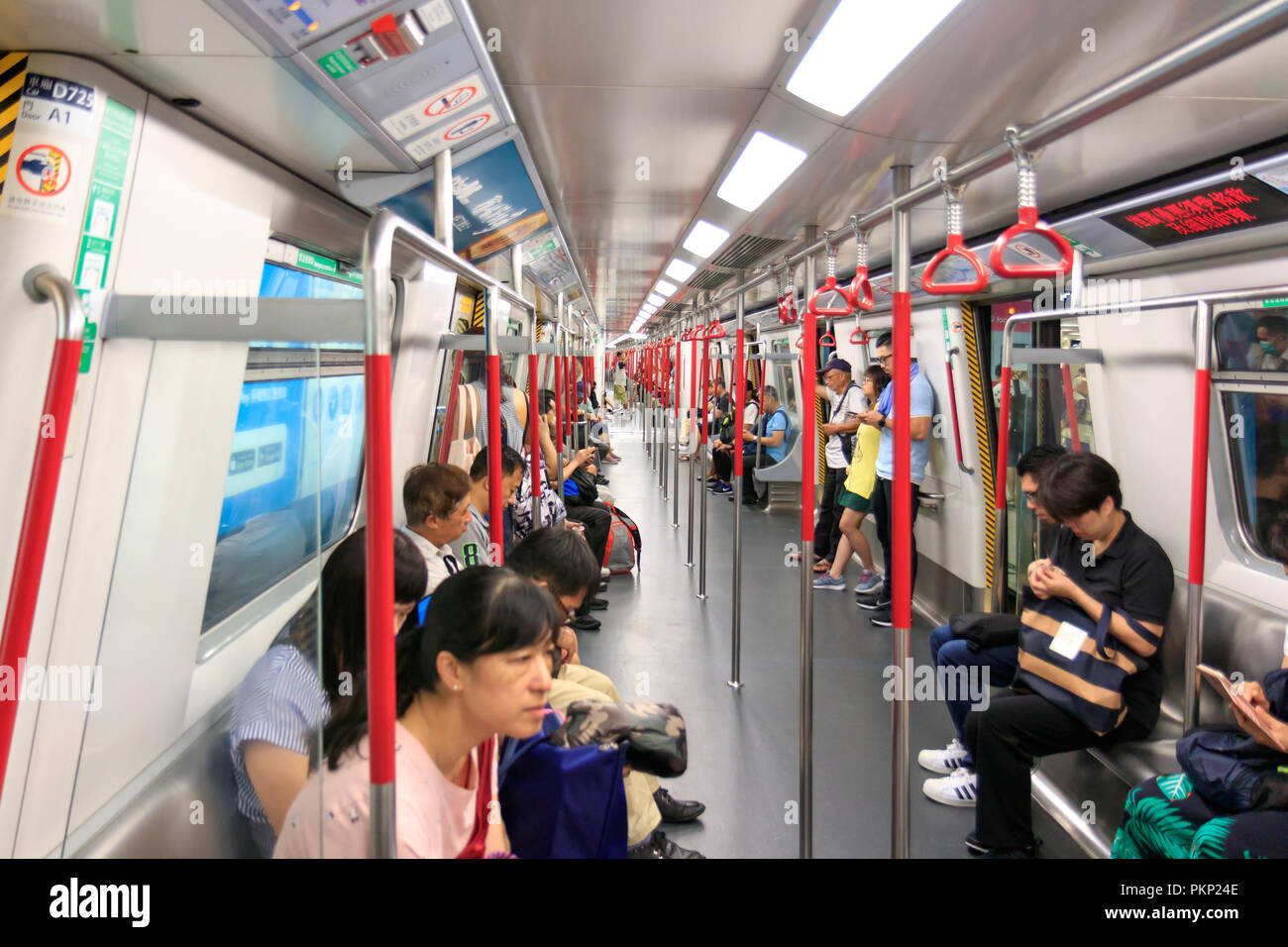 Hong Kong - July 02, 2018: People Sitting Inside The MTR Stock Photo ...