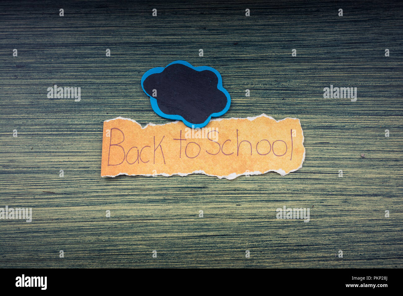 Back to school wording on a piece of torn paper Stock Photo - Alamy