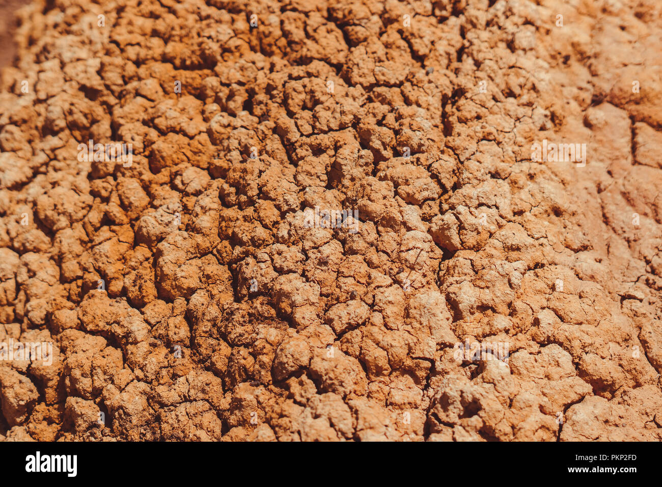 cracked red clay in the form of texture Stock Photo - Alamy