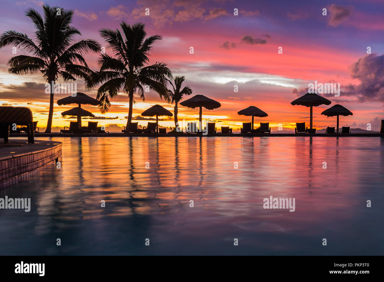 A beautiful sunset reflecting in the water in Fiji Stock Photo - Alamy