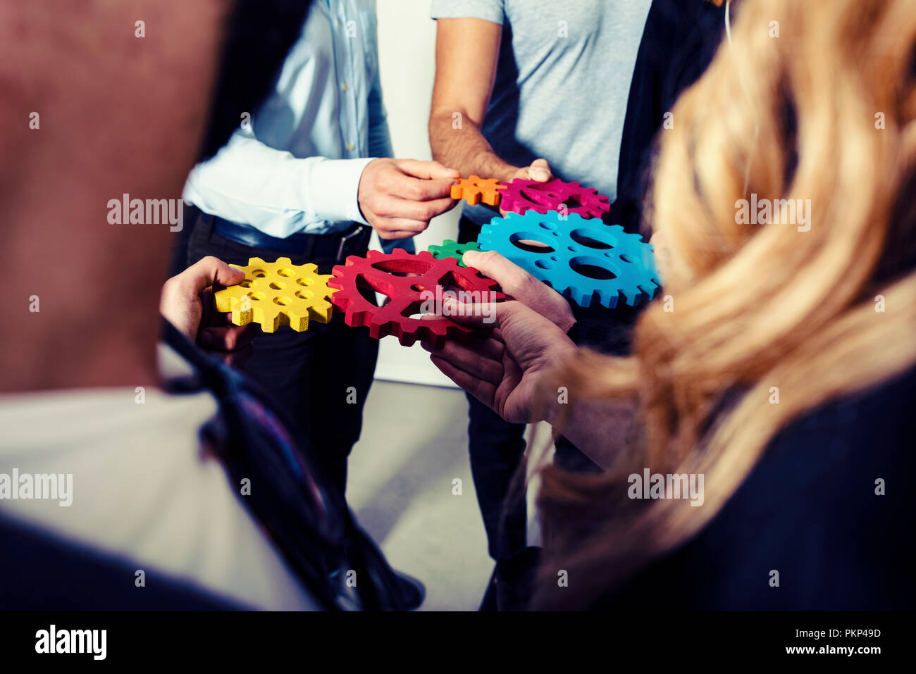 Business team connect pieces of gears. Teamwork, partnership and ...