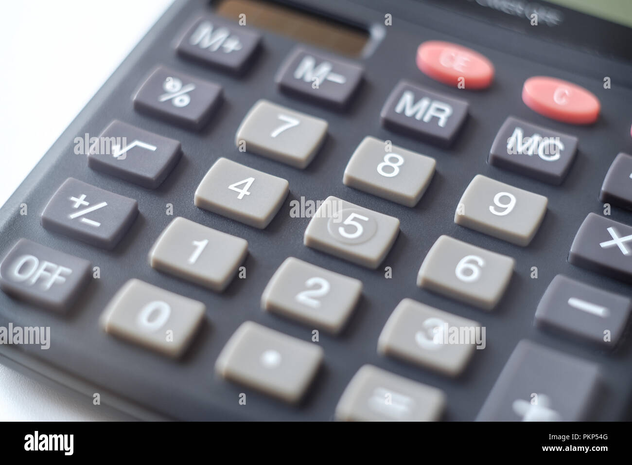 On the table, business items, calculator close-up. Buttons with numbers ...