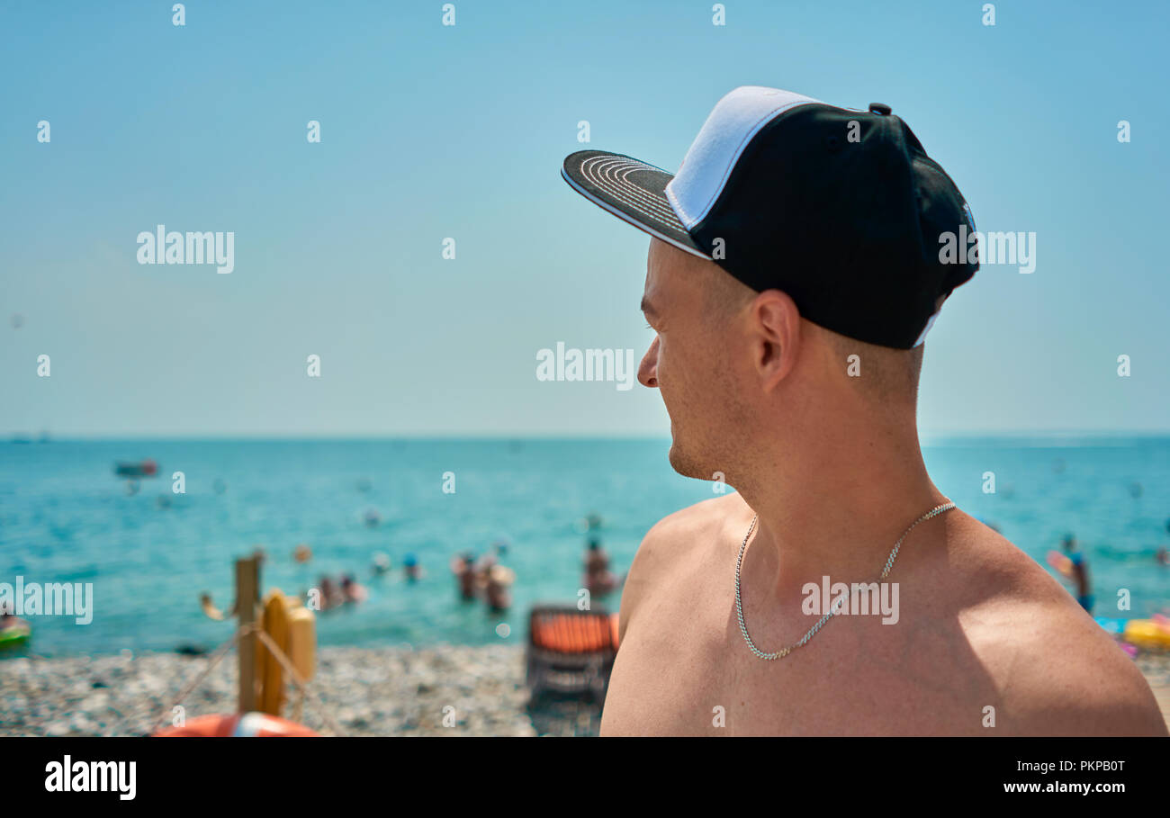 man in the cap on the beach Stock Photo - Alamy