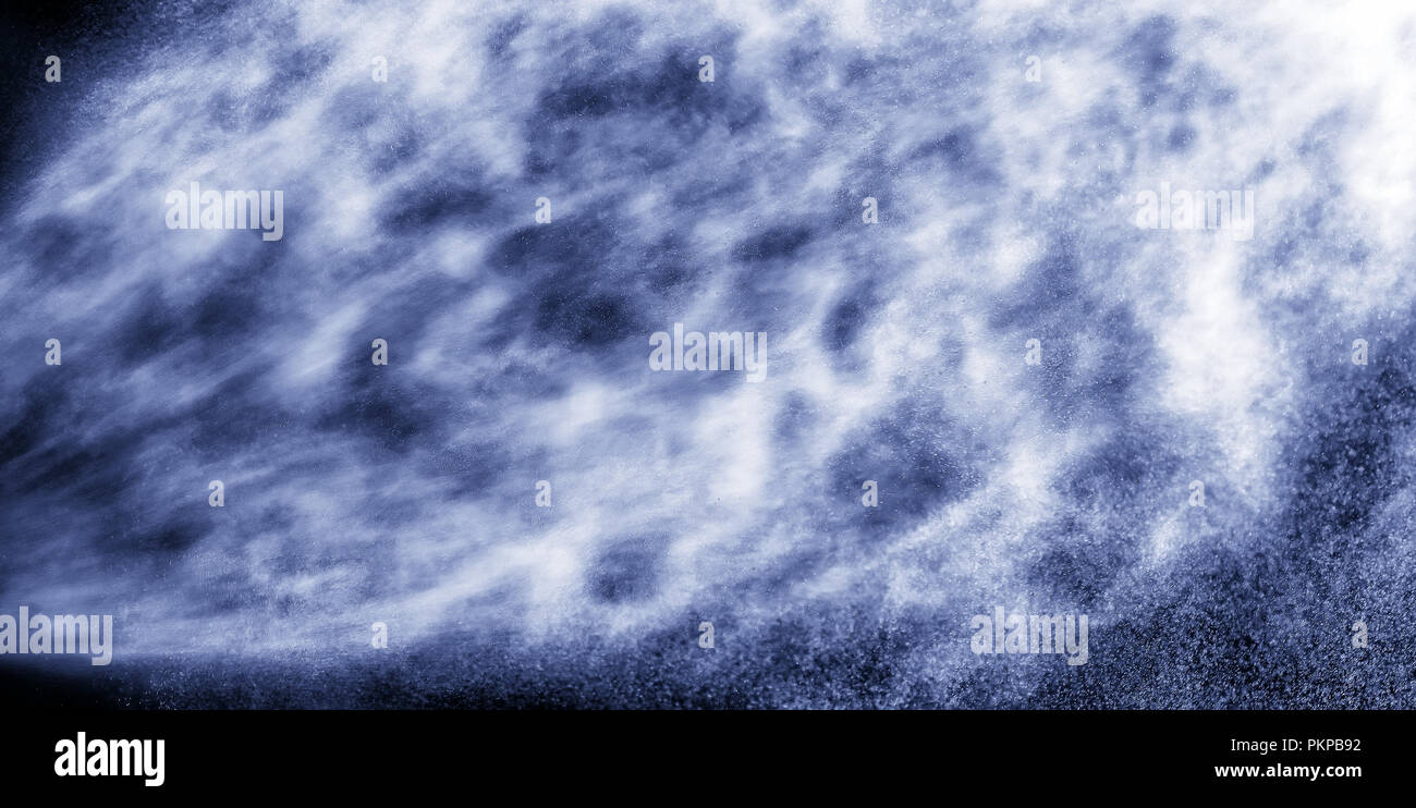 A stream of water and a cloud of drops Stock Photo - Alamy