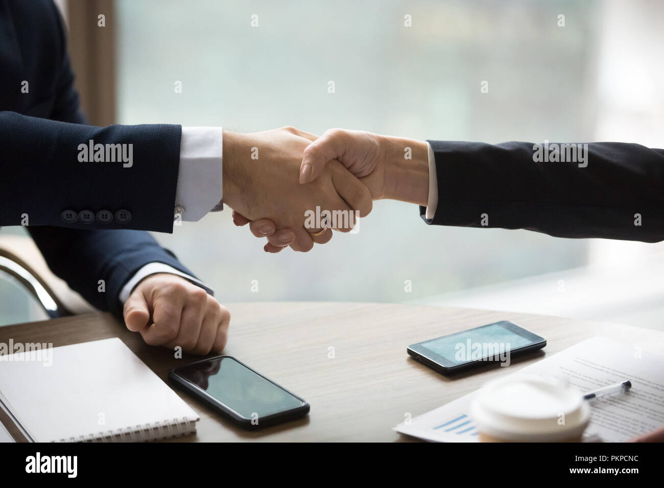 Close up handshake of two boss ceo male and woman Stock Photo - Alamy