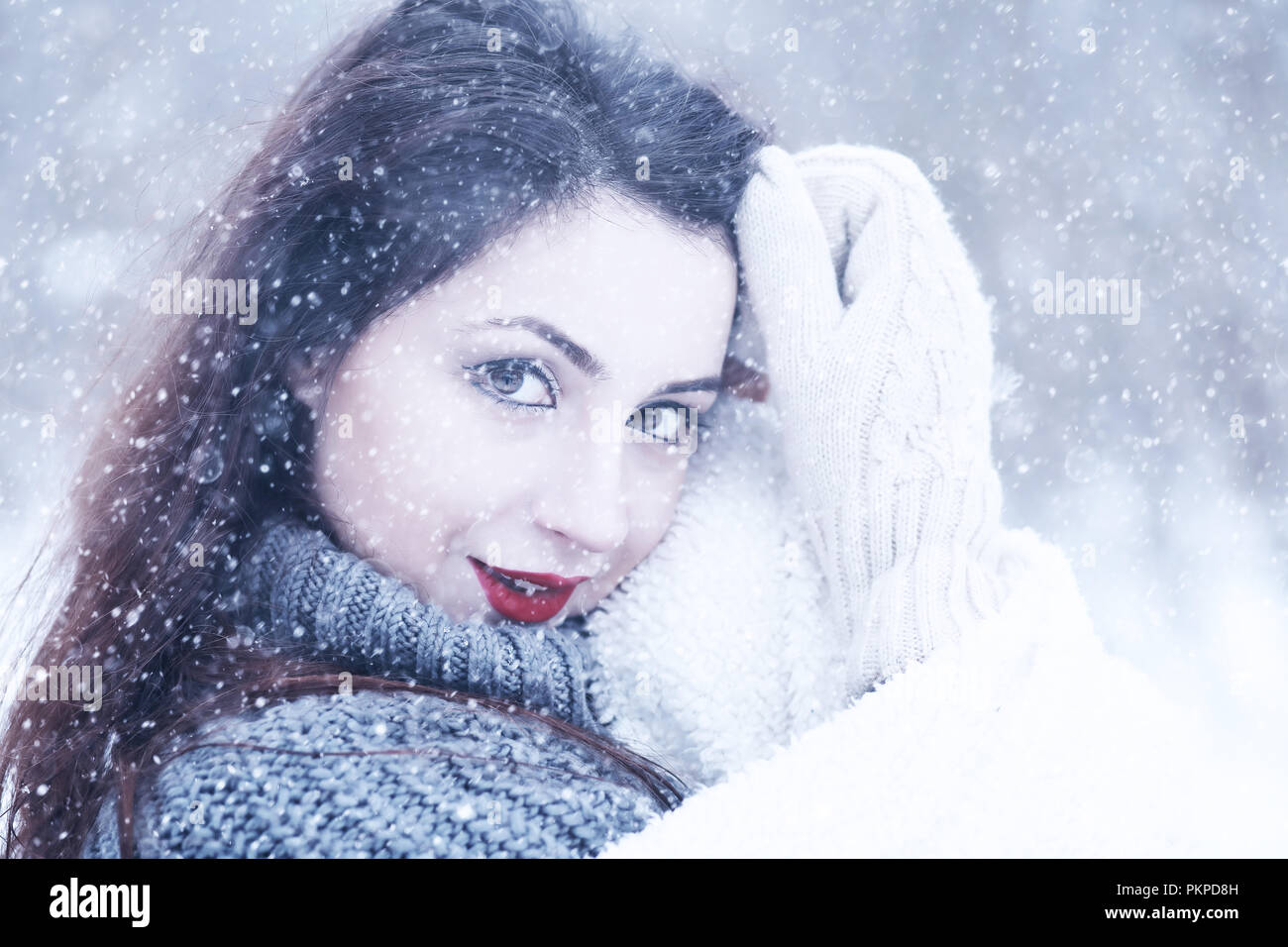Beautiful girl in a beautiful winter snow Stock Photo - Alamy