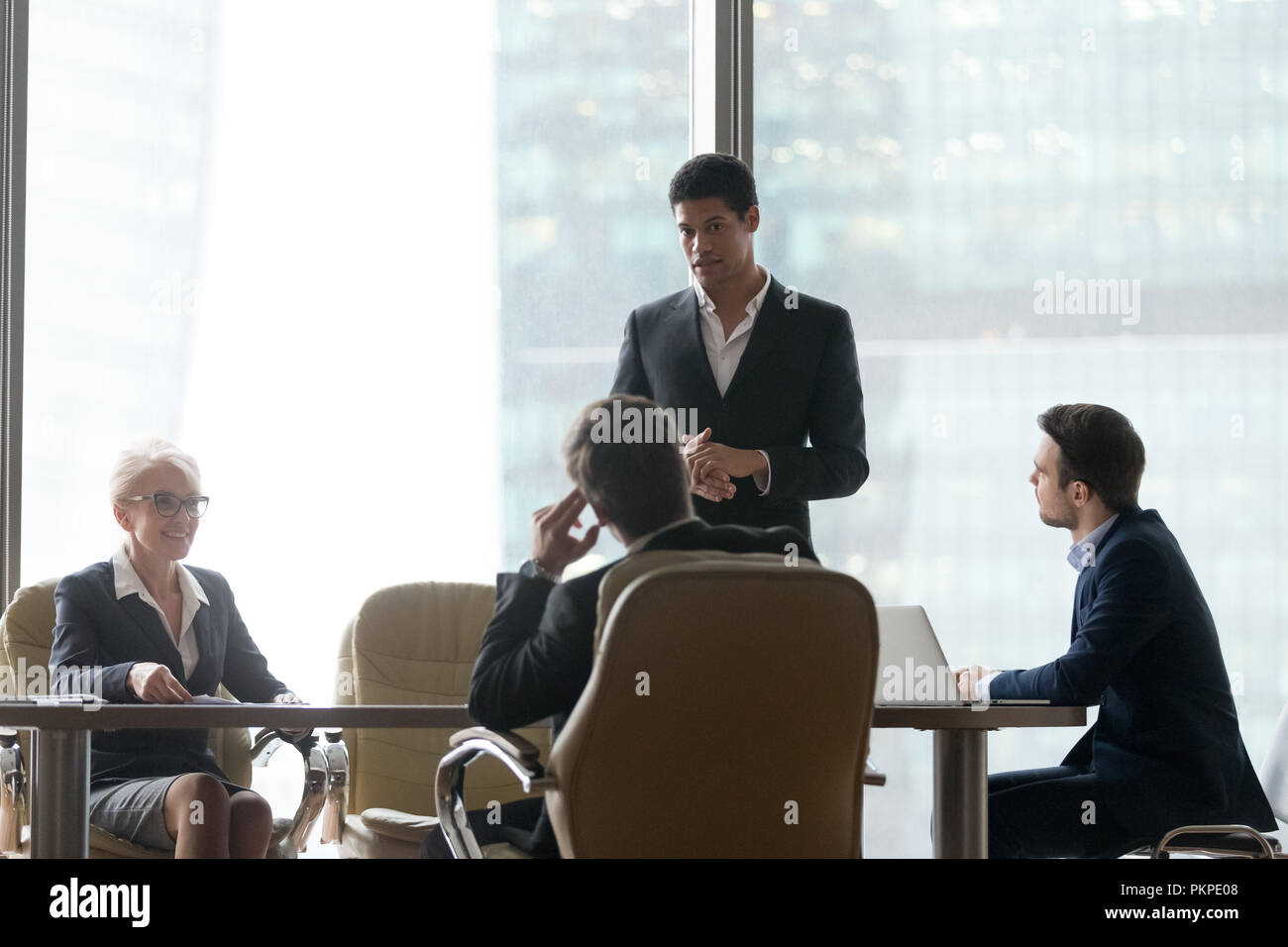African team leader with businesspeople colleagues at boardroom Stock ...