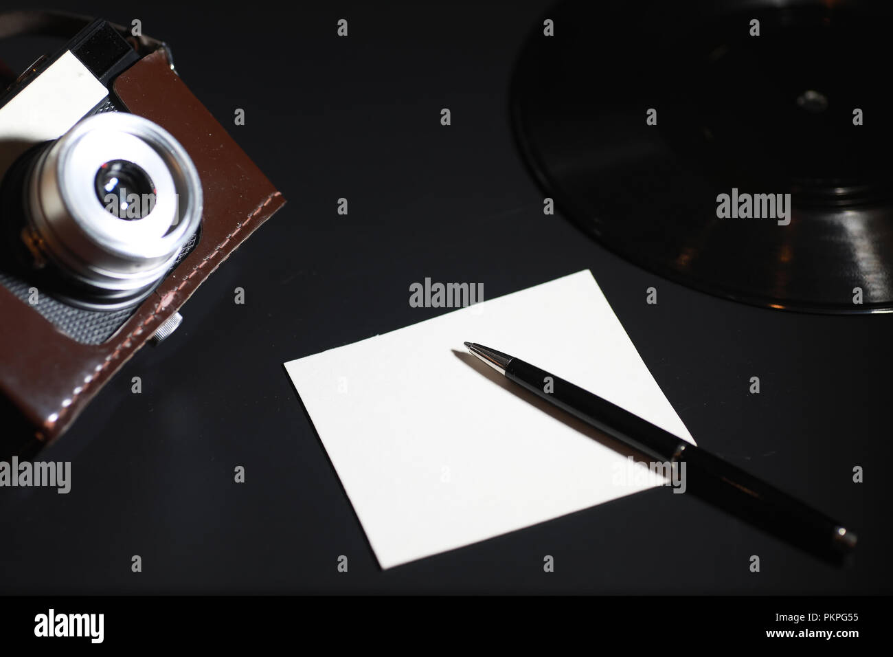 Vinyl plate and retro camera Stock Photo - Alamy
