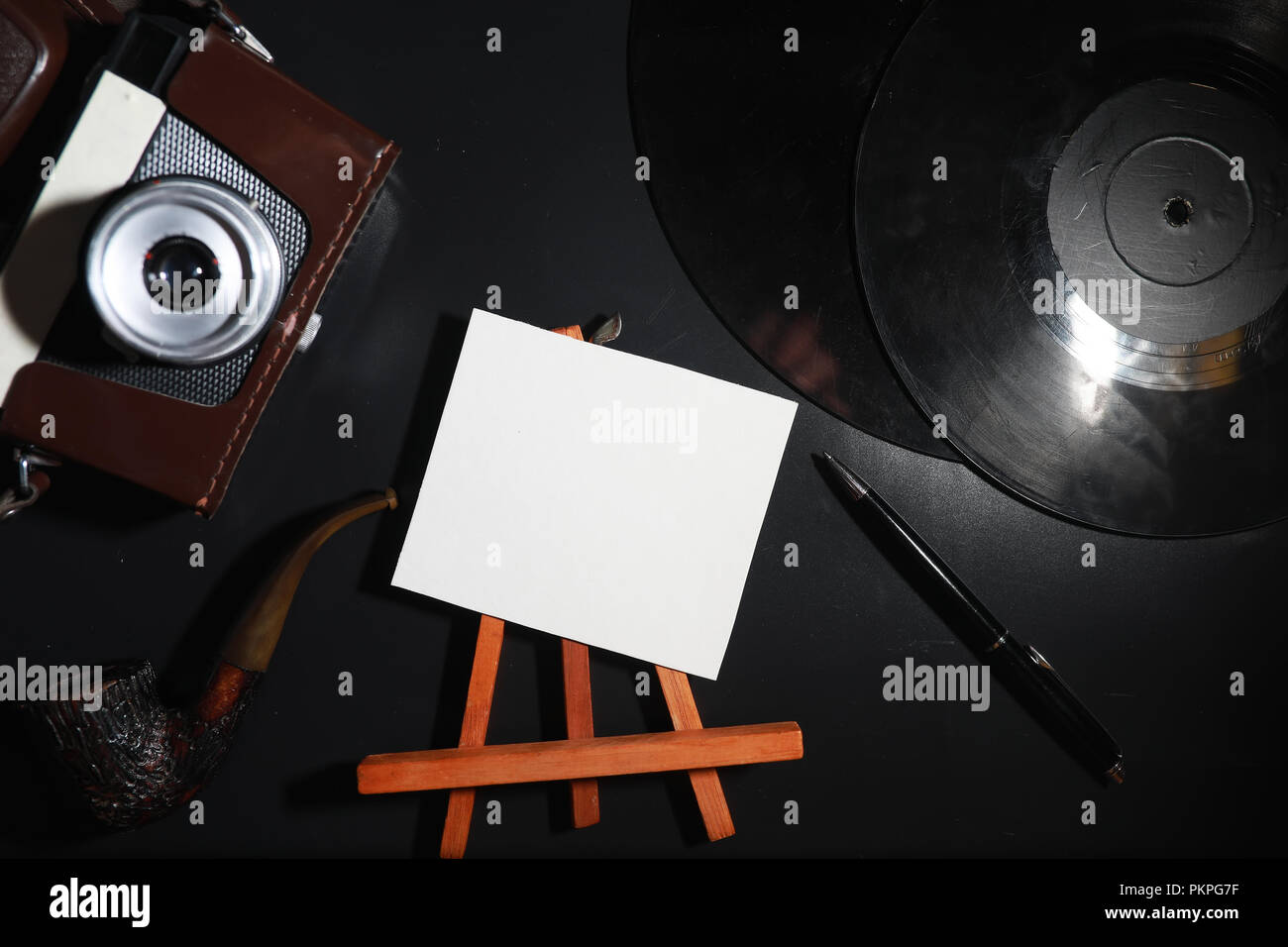 Vinyl plate and retro camera Stock Photo - Alamy