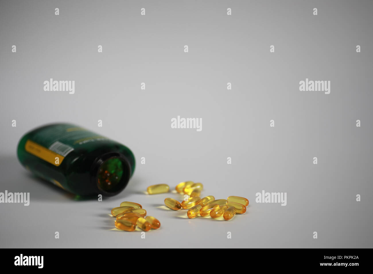 Medical drugs transparent capsules of yellow color Stock Photo - Alamy