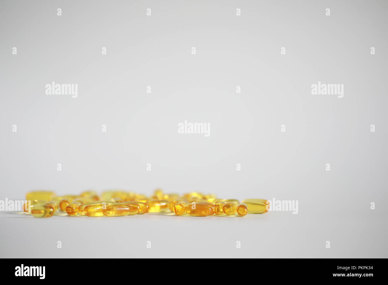 Medical drugs transparent capsules of yellow color Stock Photo - Alamy