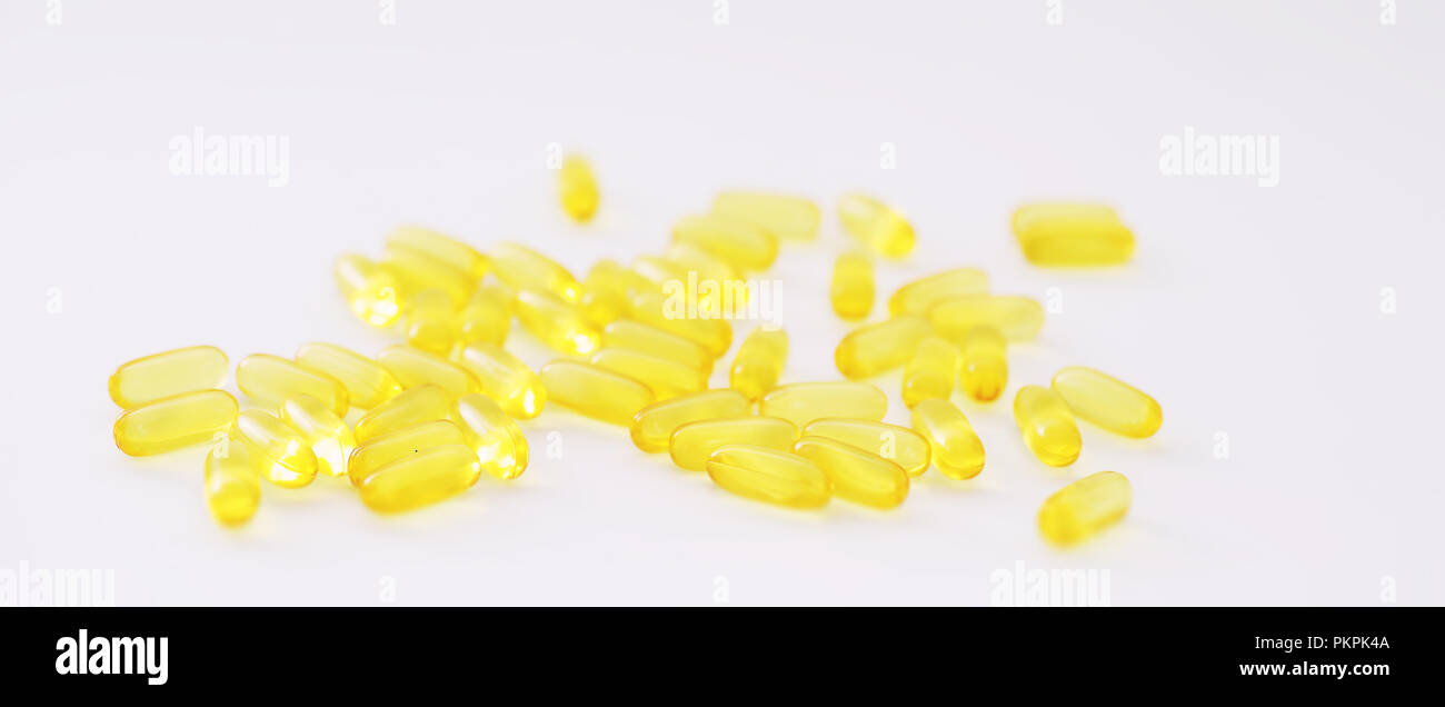 Medical drugs transparent capsules of yellow color Stock Photo - Alamy