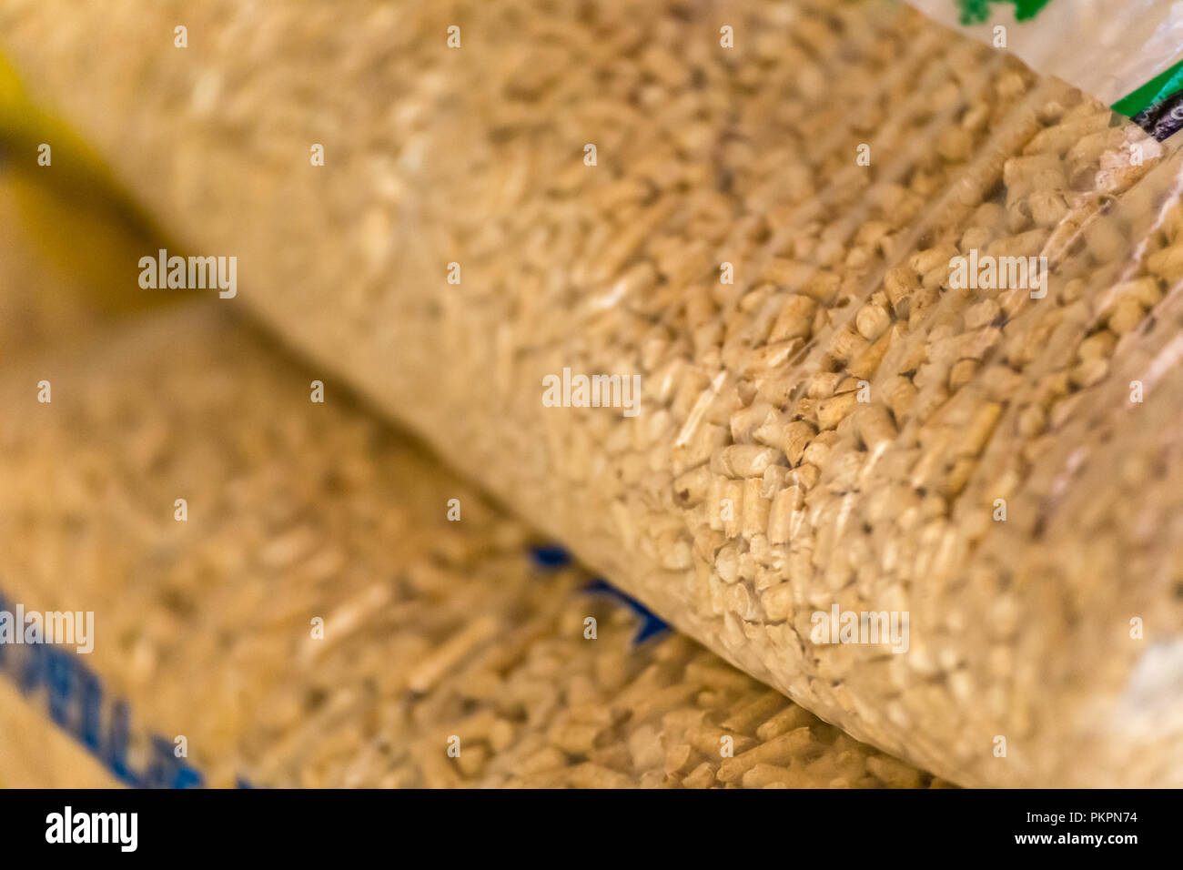 Bags of compressed wood pellets Stock Photo - Alamy