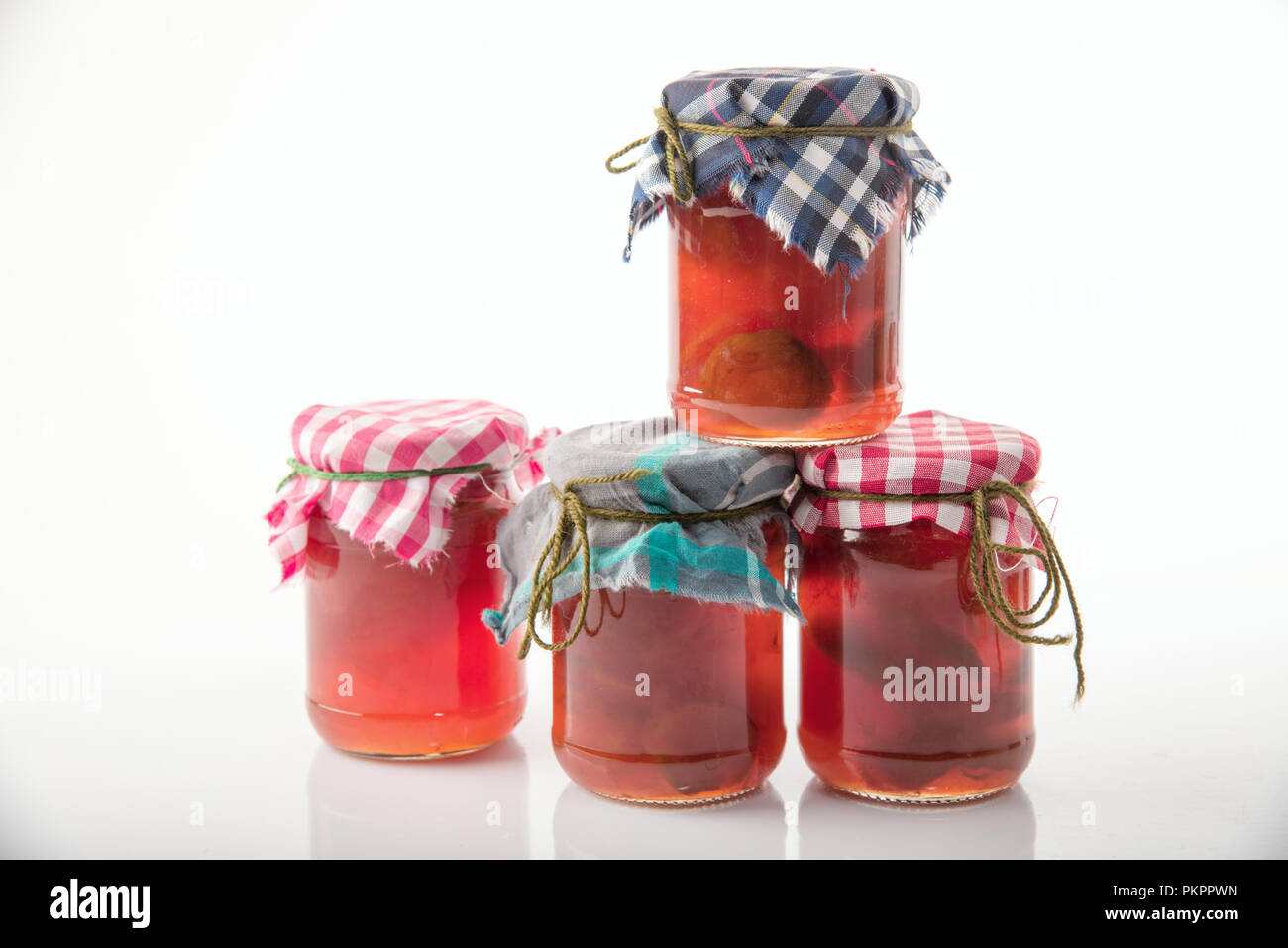 jam in jars with fabric covers Stock Photo - Alamy