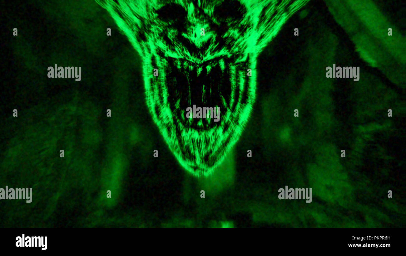 Angry demon face screams in abandoned house. Genre of horror. Green ...