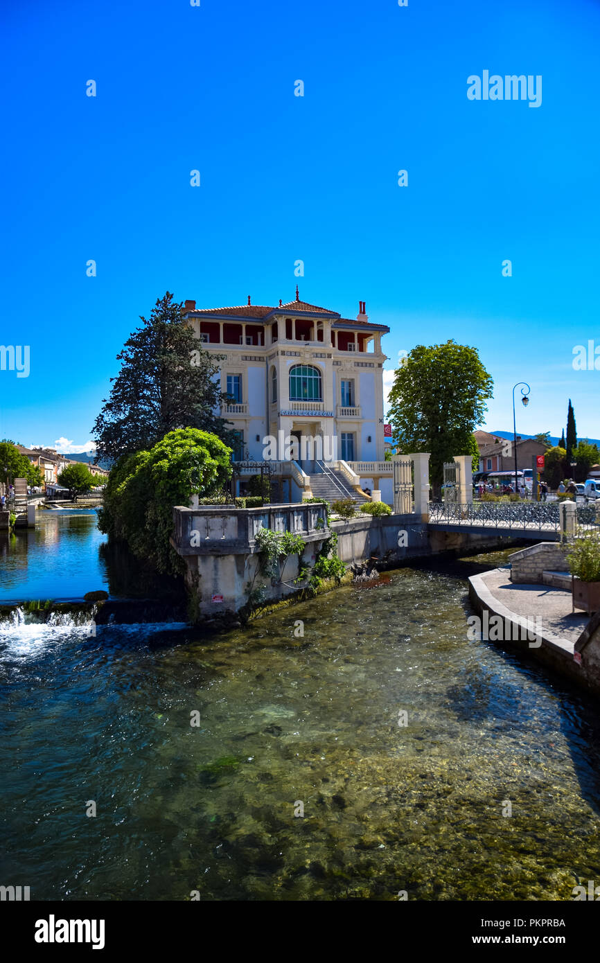 The lovely village of Isle Sur la Sorgue straddling the Sorgue RIver in ...