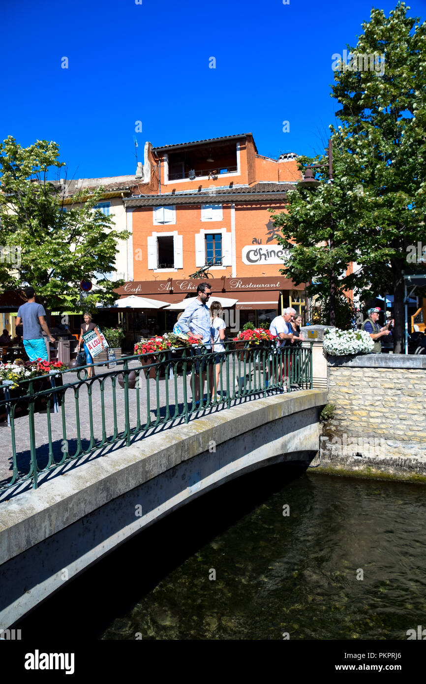 The lovely village of Isle Sur la Sorgue straddling the Sorgue RIver in ...