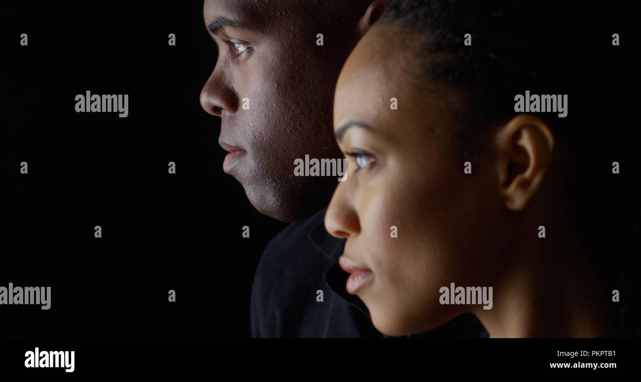 Dramatic profile rack focus of two young black people Stock Photo - Alamy