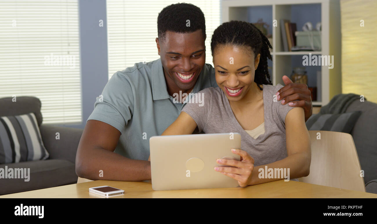 Black couple using tablet desk hi-res stock photography and images - Alamy
